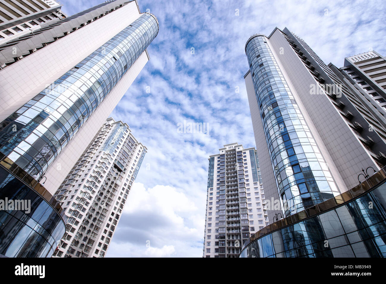 Daytime and nighttime photos at new successful district. High buildings ...