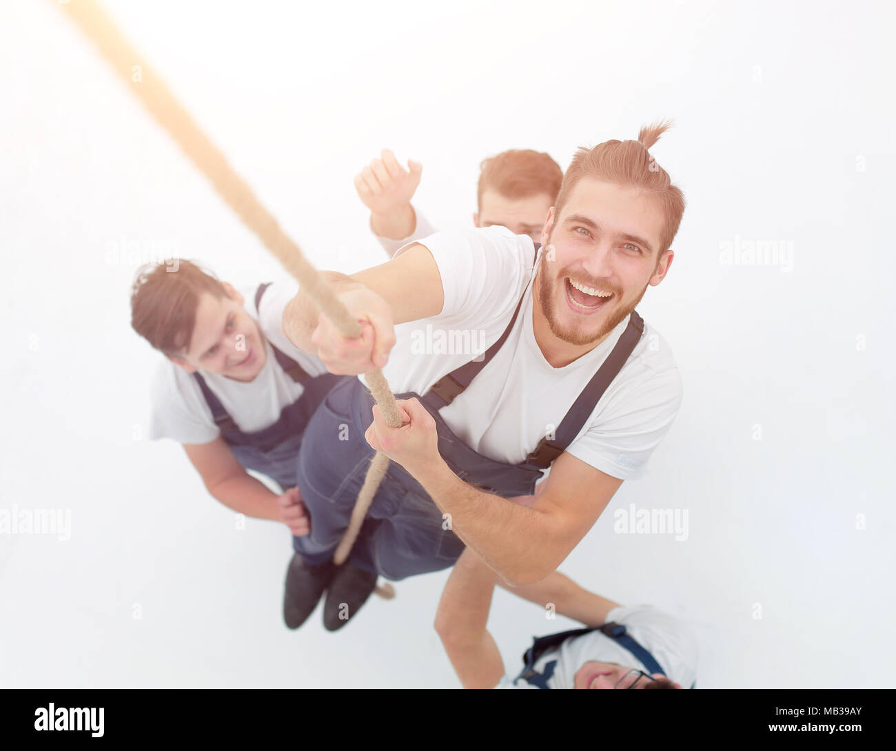 view from the top.smiling engineer ,climbing up the rope Stock Photo ...