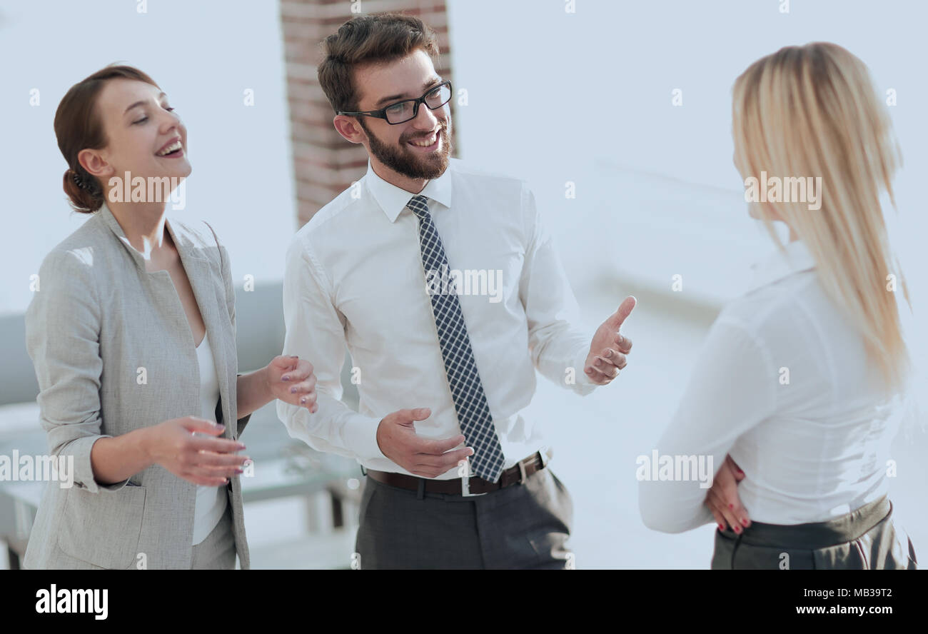 Manager and business team talking in the office Stock Photo - Alamy