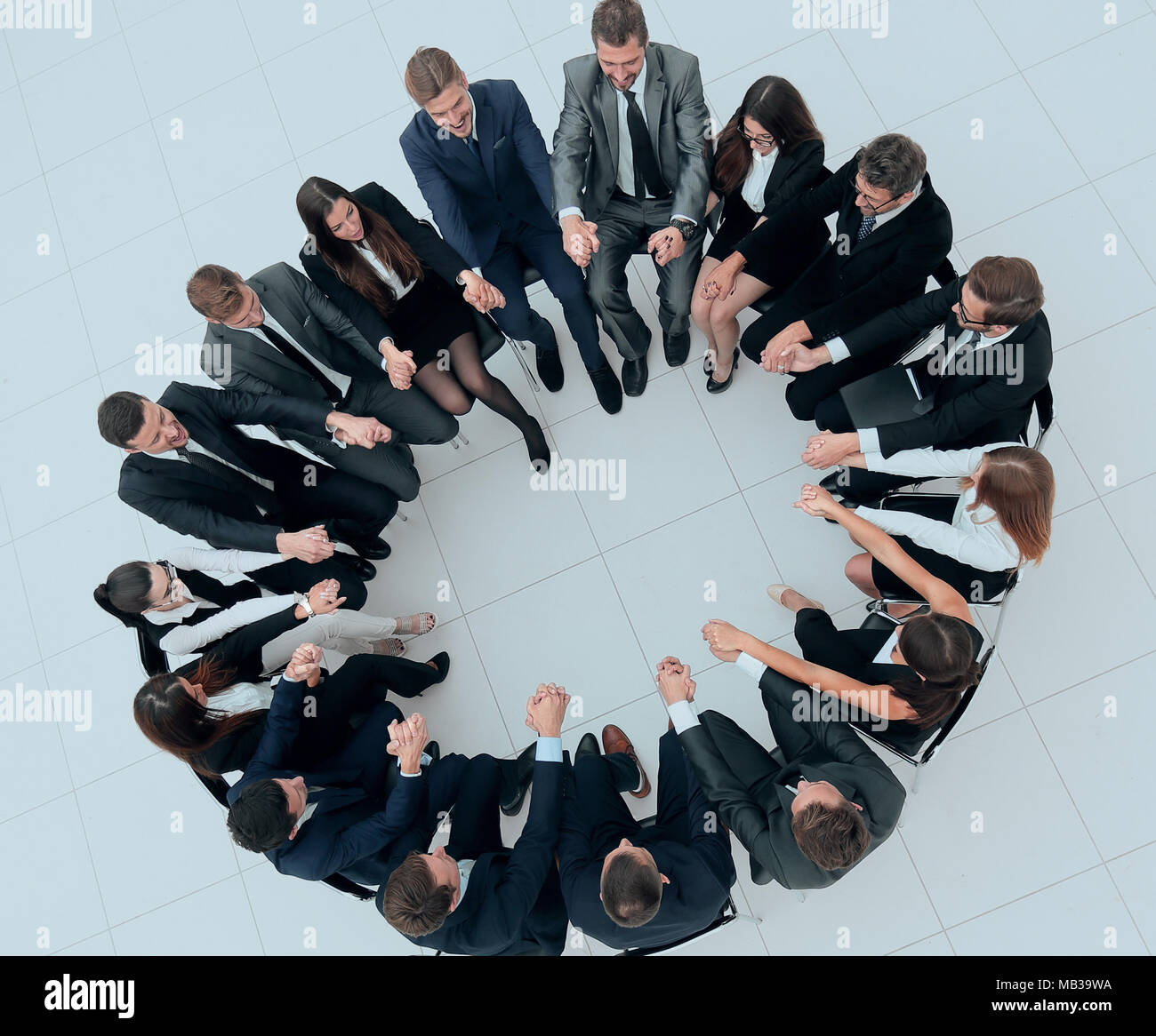 concept of team building.large business team sitting in a circle Stock ...