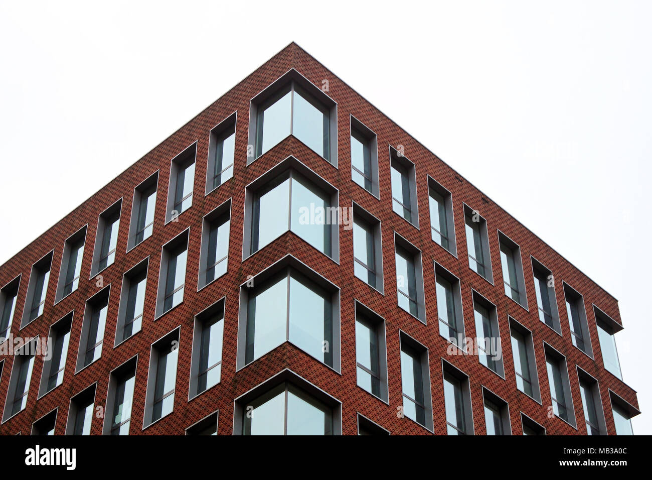 Top of brick residential building and minimalism architecture facade ...