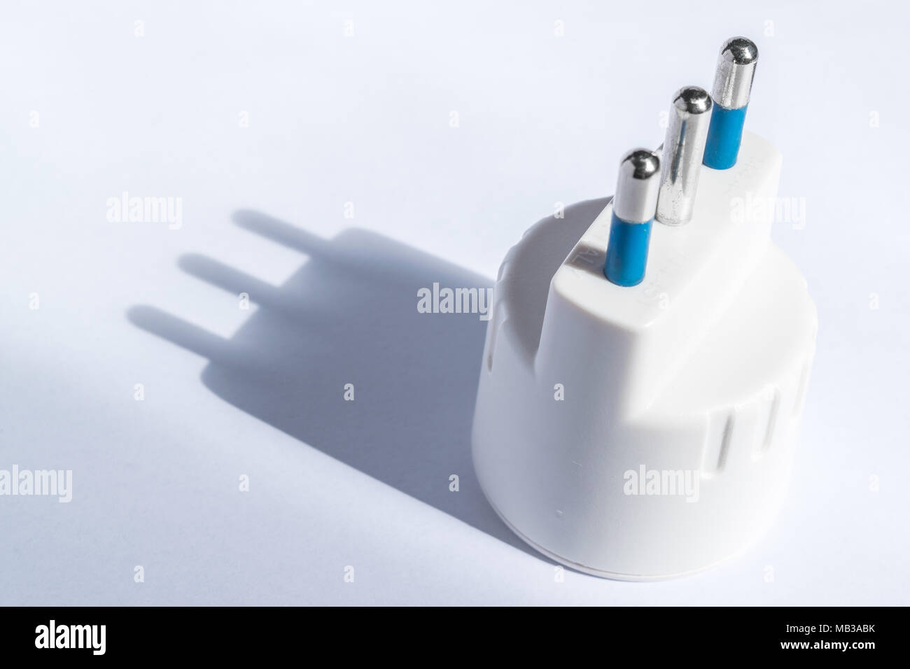 White and blue plug on white background Stock Photo - Alamy