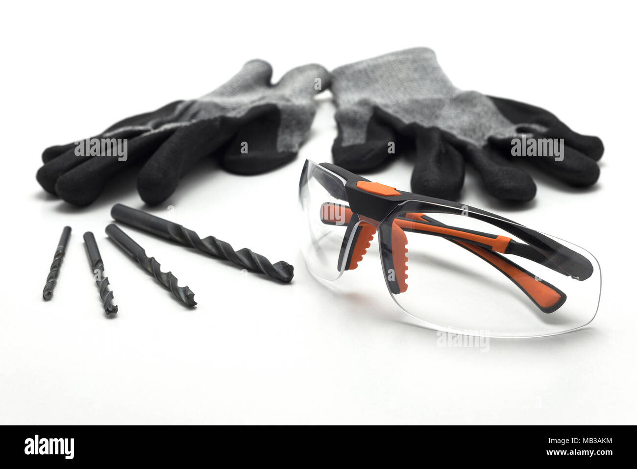 Safety Glasses protection and gloves, visible set of drills. Isolated ...