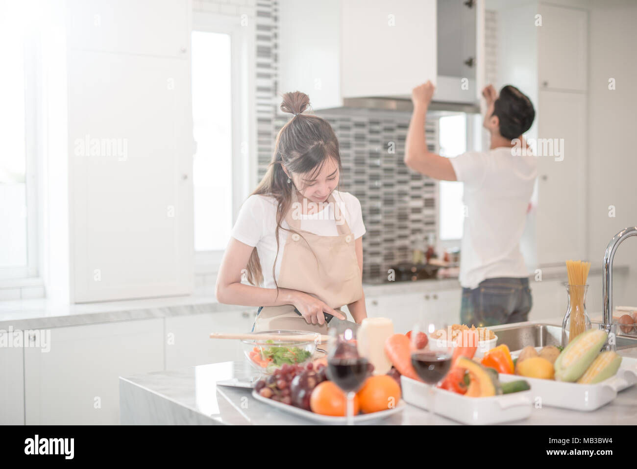 Male teen cooking happy hi-res stock photography and images - Alamy