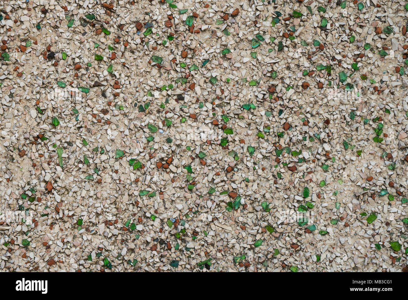 Closeup stucco with Colorful glass and small stone wall texture and ...