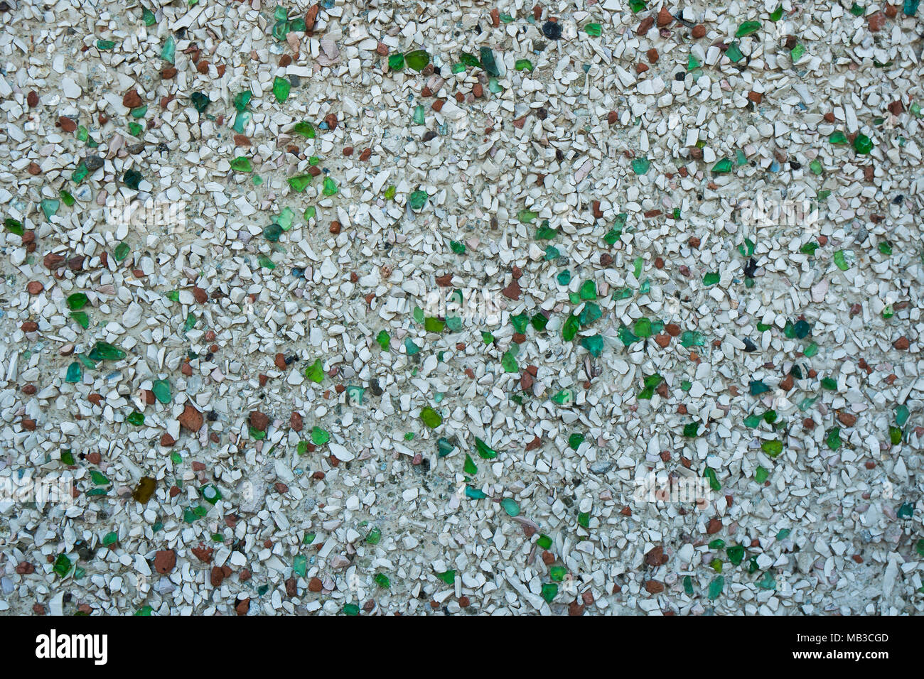 Closeup stucco with Colorful glass and small stone wall texture and ...