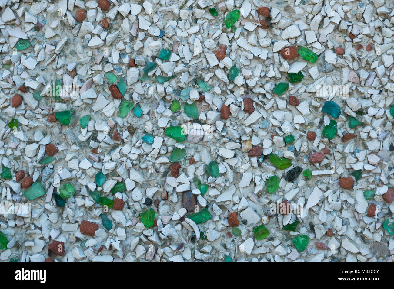 Closeup stucco with Colorful glass and small stone wall texture and ...