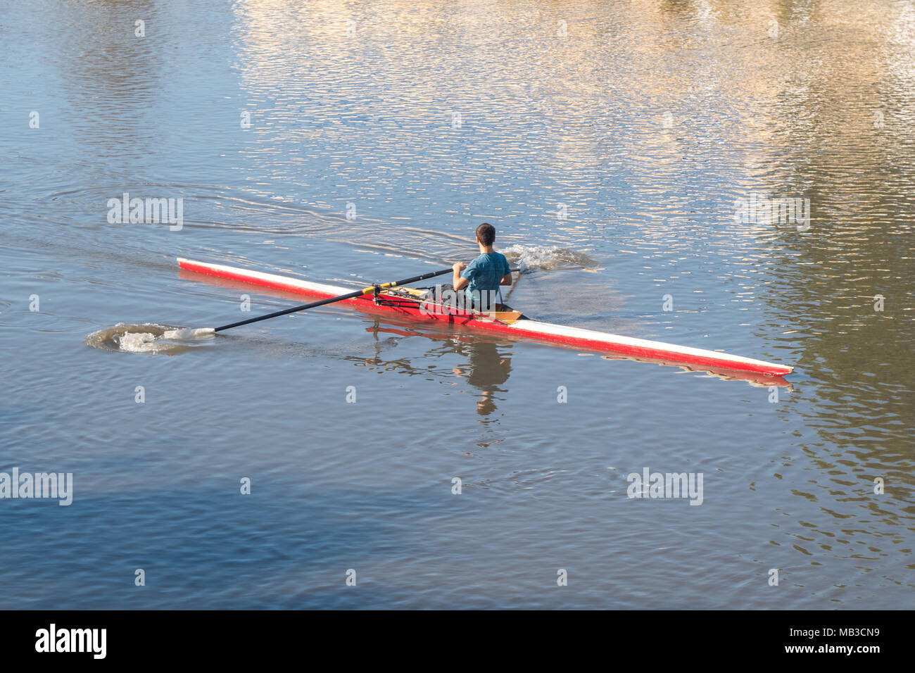 Teenage sportsman in a boat, rowing on the river Rioni, Poti, Georgia ...