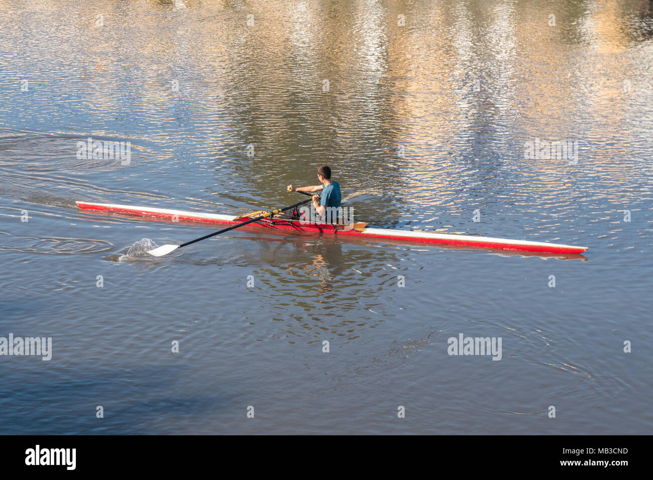 Teenage sportsman in a boat, rowing on the river Rioni, Poti, Georgia ...