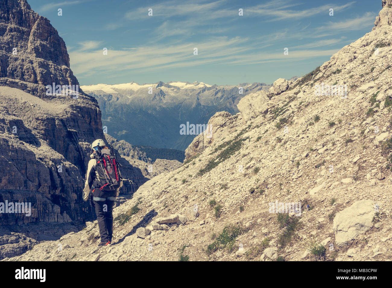 Hiker on a mountain trail Stock Photo - Alamy