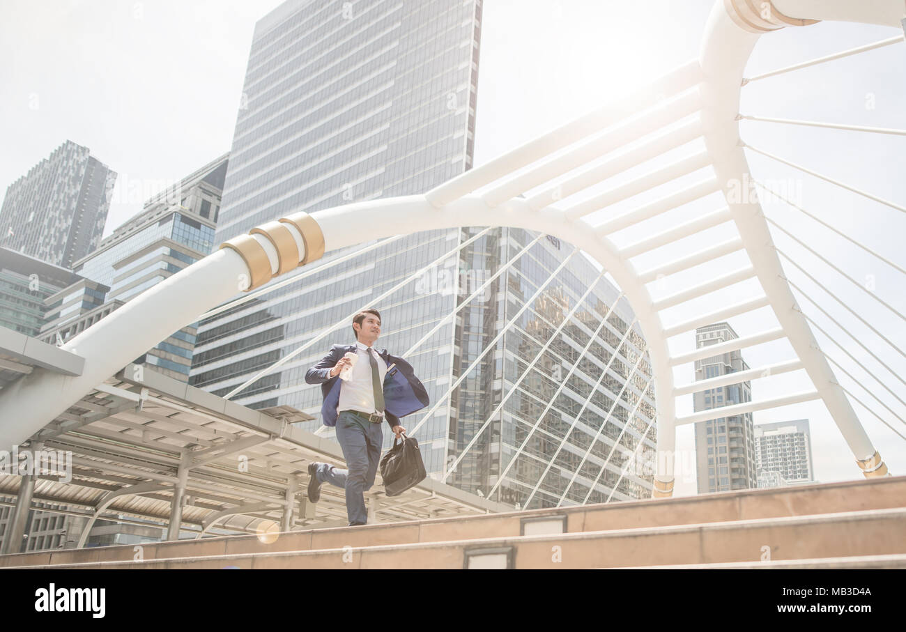 running business man in front of buildings hurry and rush because work ...