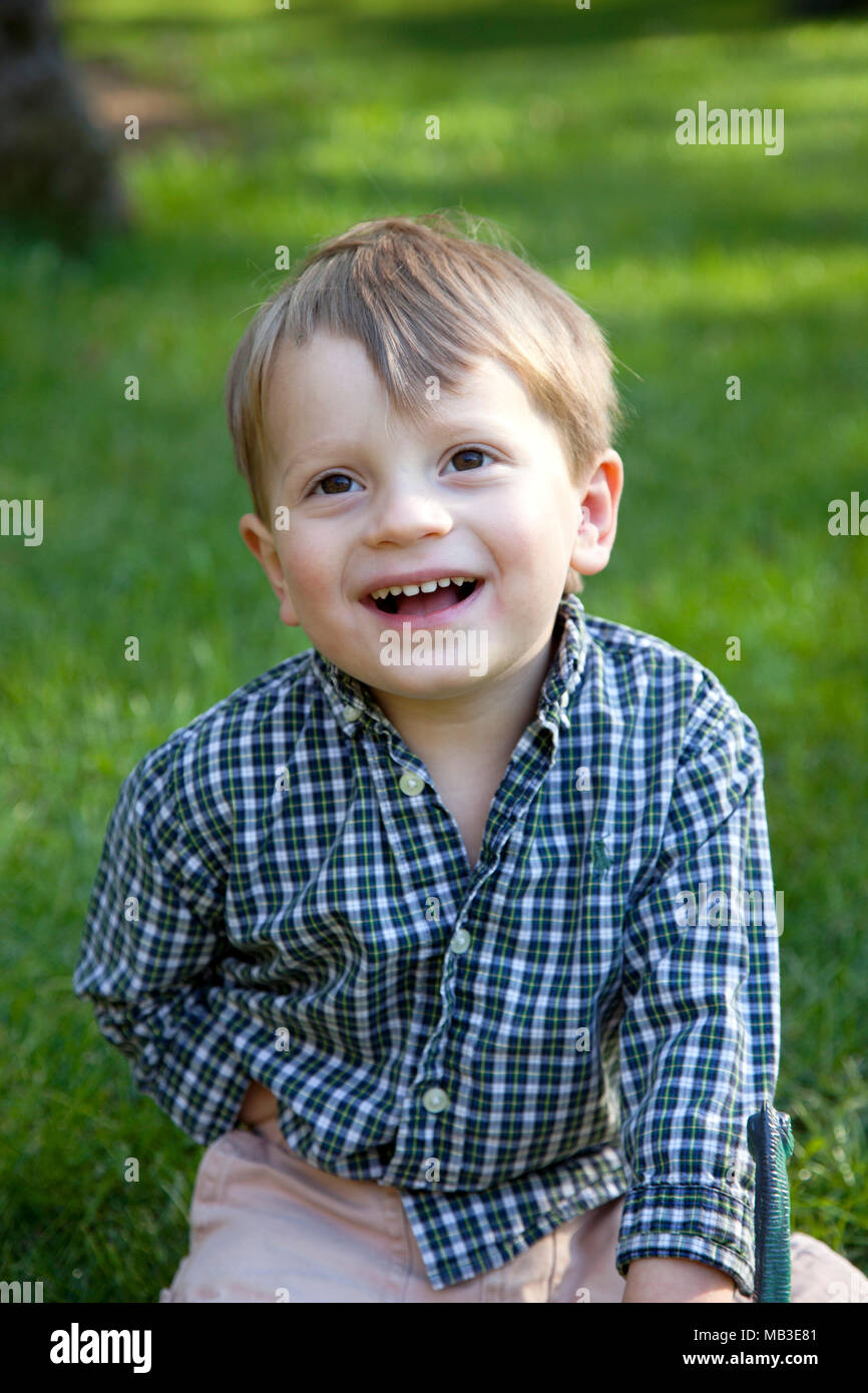 Smiling Young Boy Looking Up Stock Photo - Alamy