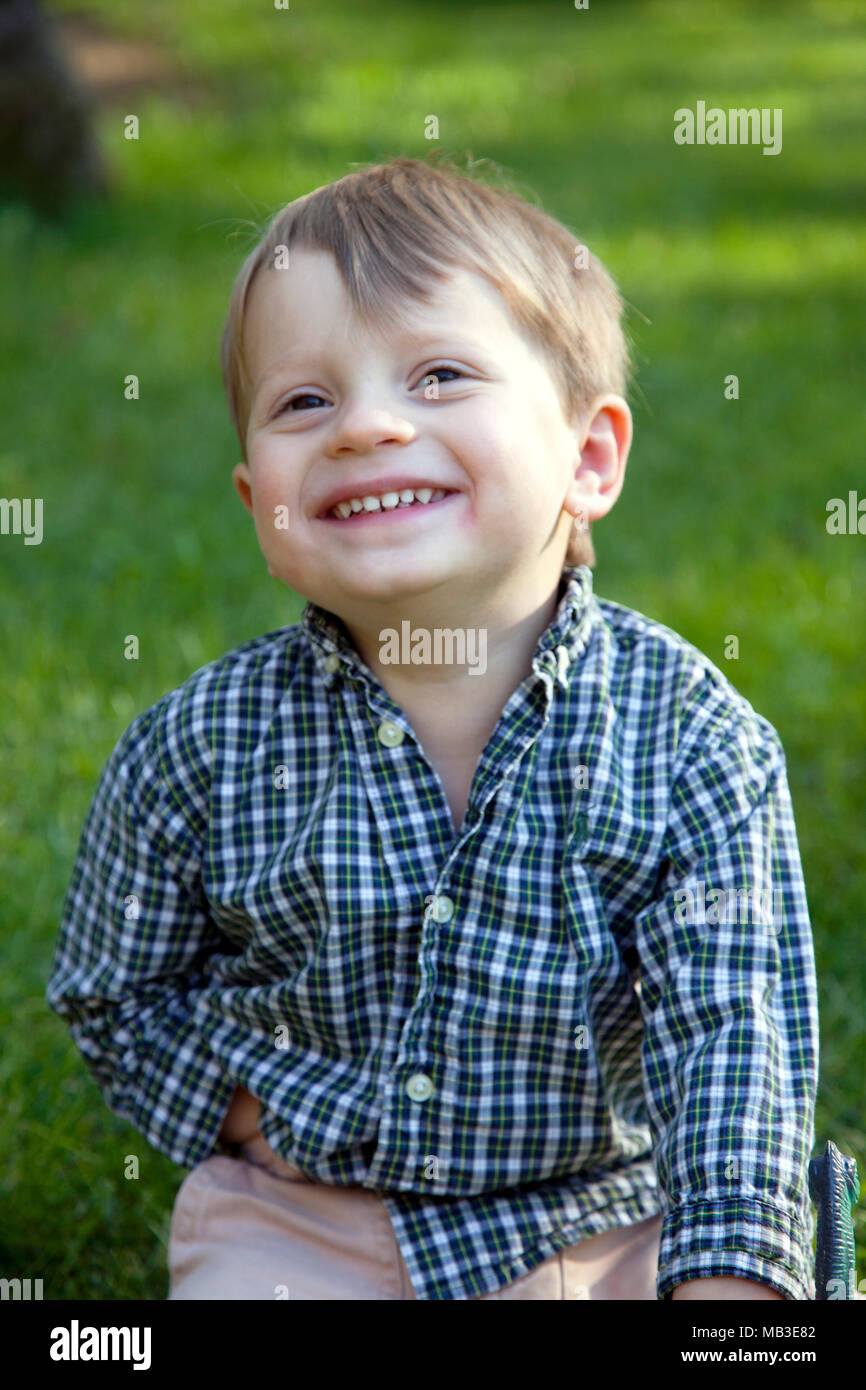 Smiling Young Boy Looking Up Stock Photo - Alamy