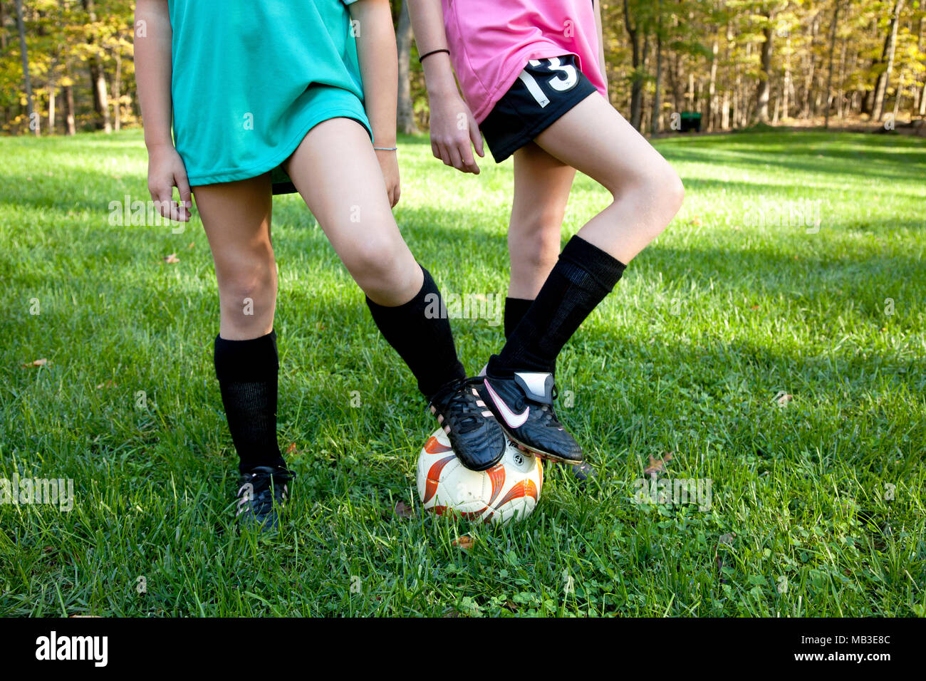 Girl's Legs and Soccer Ball Stock Photo - Alamy