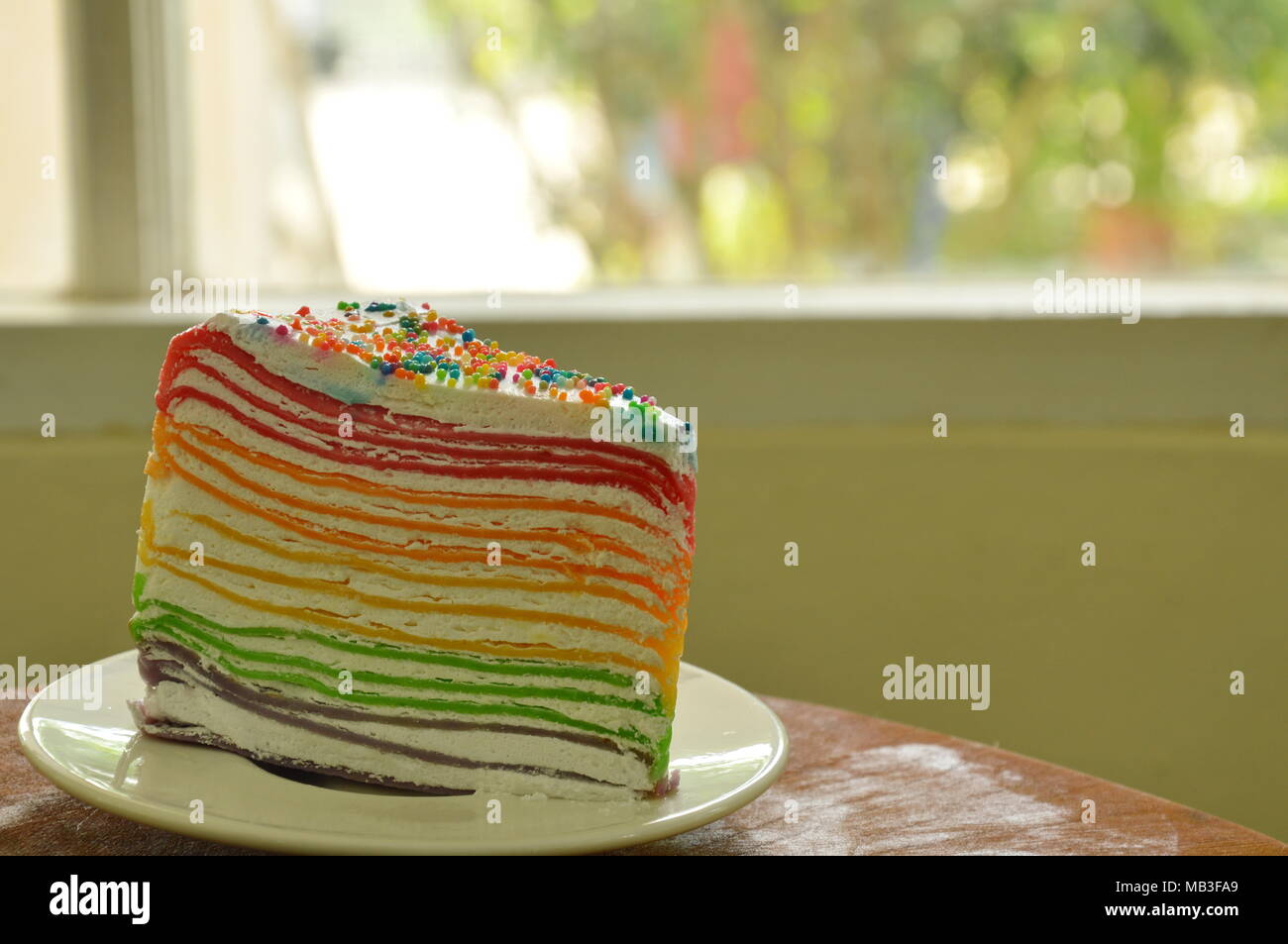 crape cake on dish near the window Stock Photo - Alamy