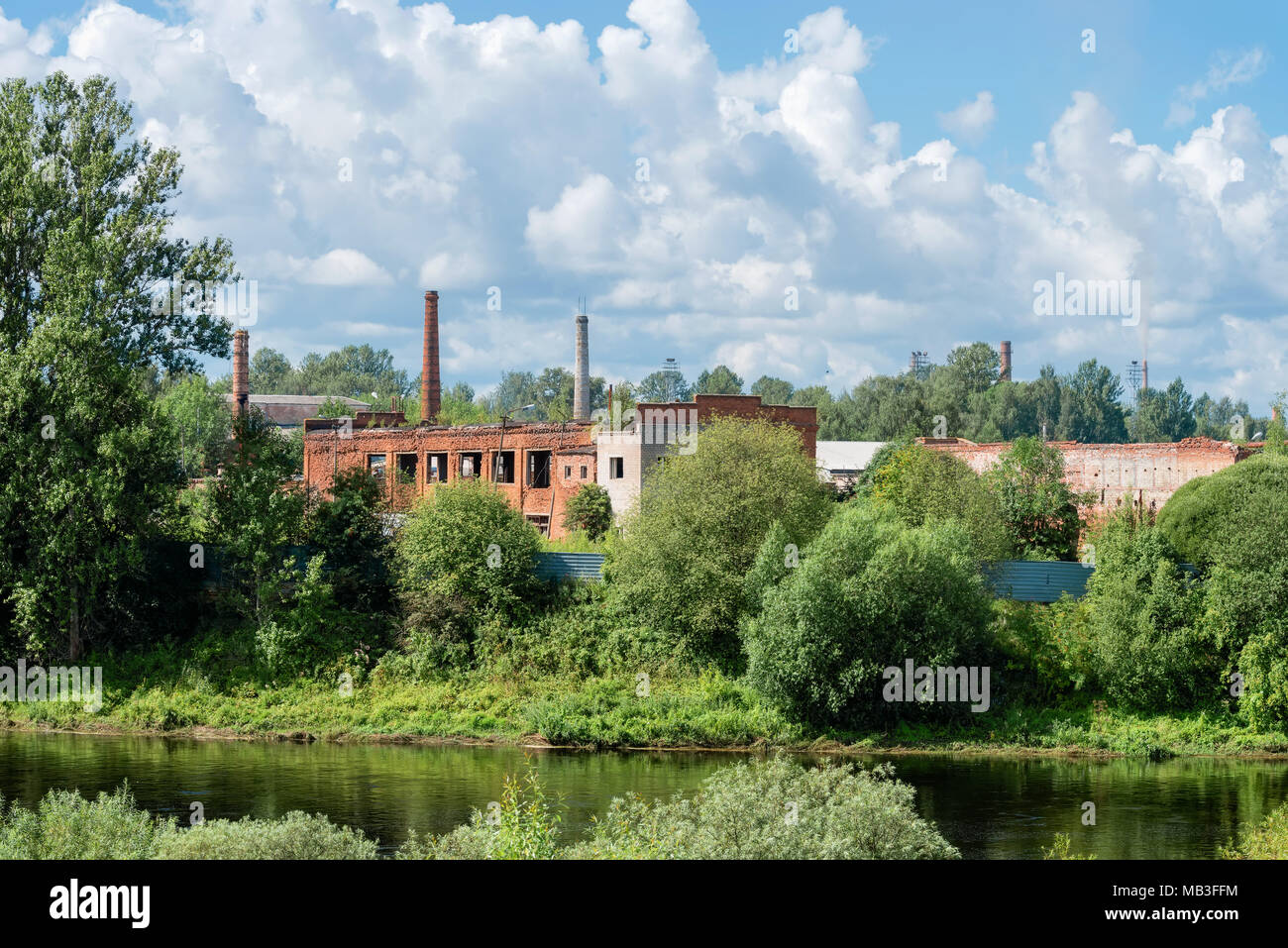 Old ruined factory building on the banks of the river Stock Photo - Alamy