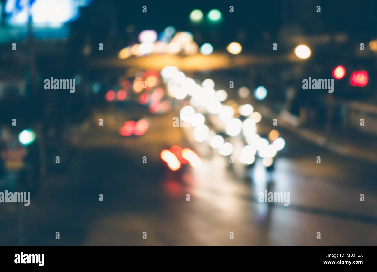 Bokeh lights car traffic jam of a street road at night retro color ...