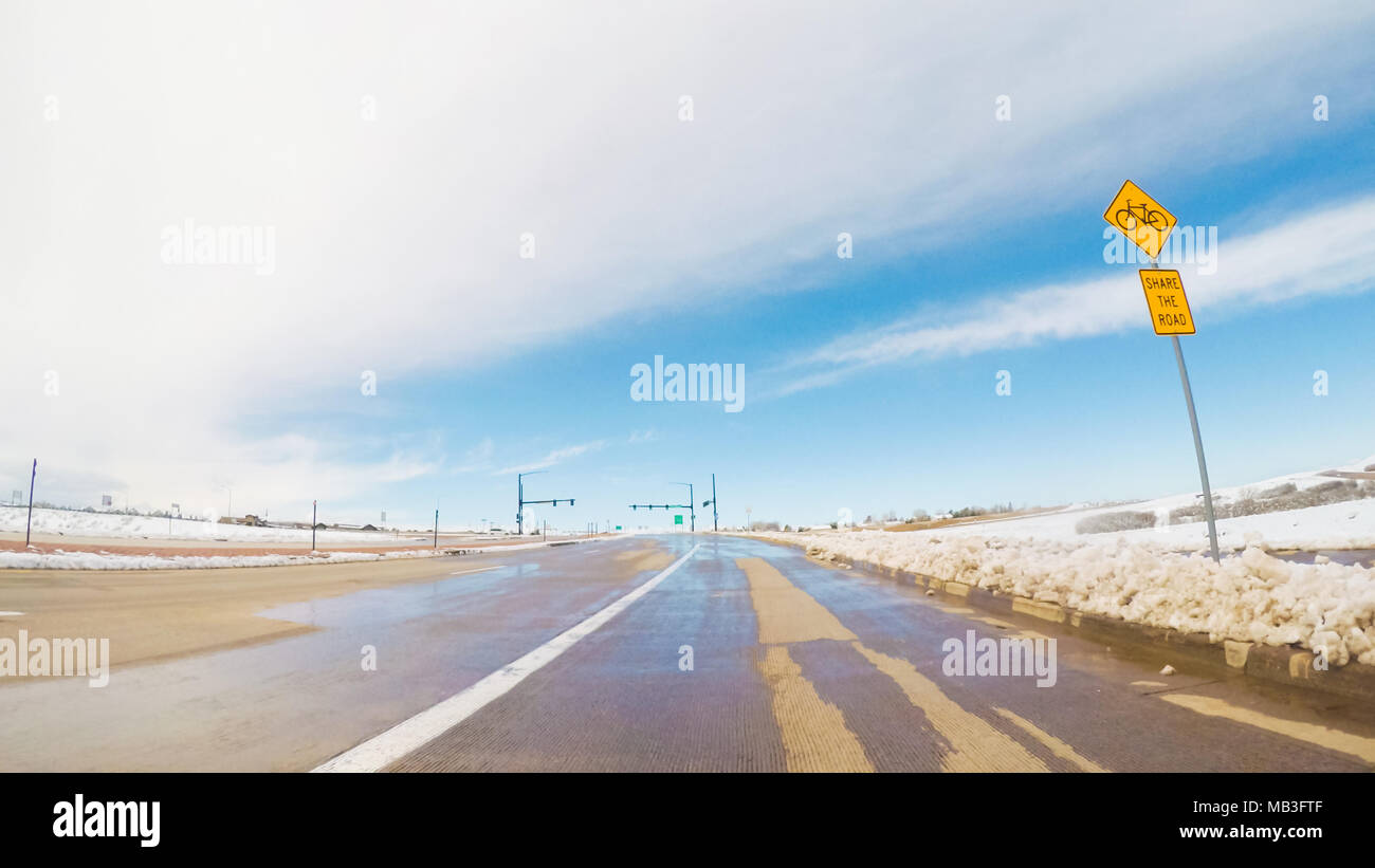 Driving on suburban road after Spring snow storm Stock Photo - Alamy