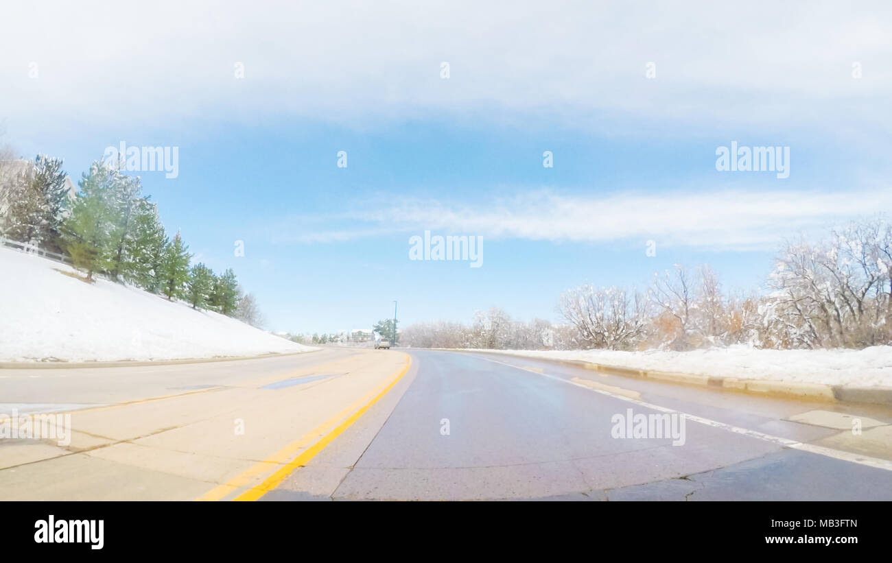Driving on suburban road after Spring snow storm Stock Photo - Alamy