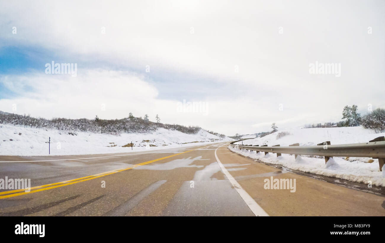 Driving on suburban road after Spring snow storm Stock Photo - Alamy