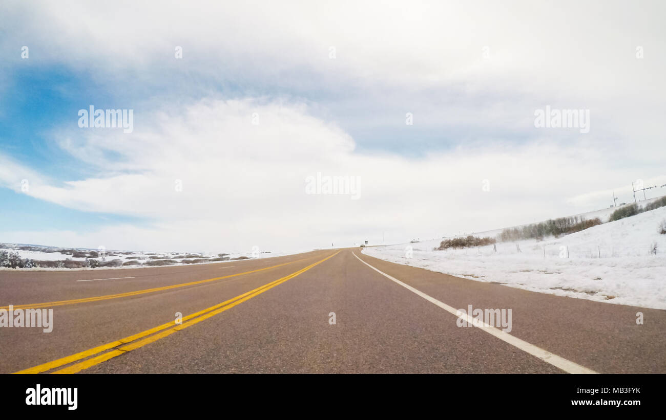 Driving on suburban road after Spring snow storm Stock Photo - Alamy