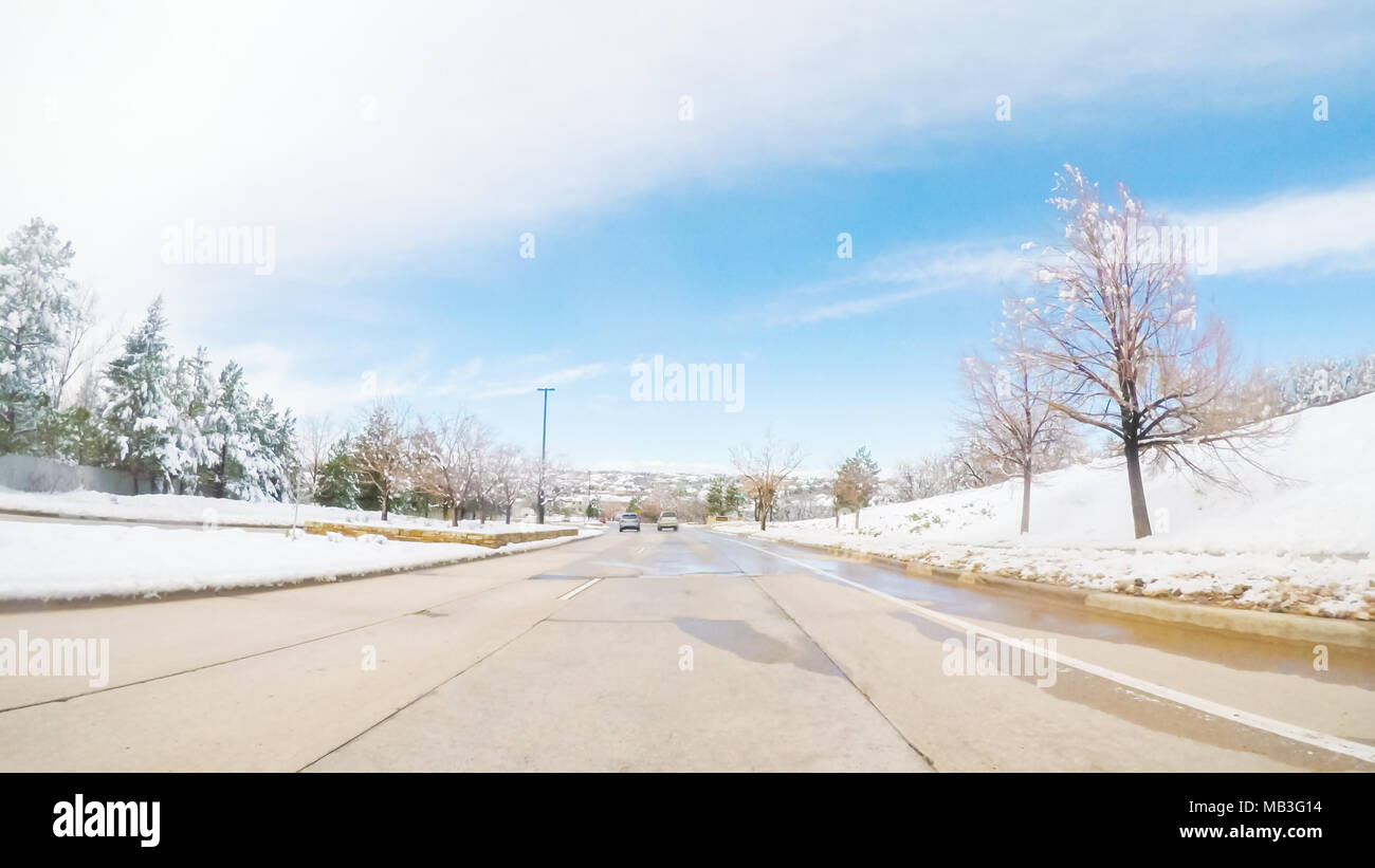 Driving on suburban road after Spring snow storm Stock Photo - Alamy