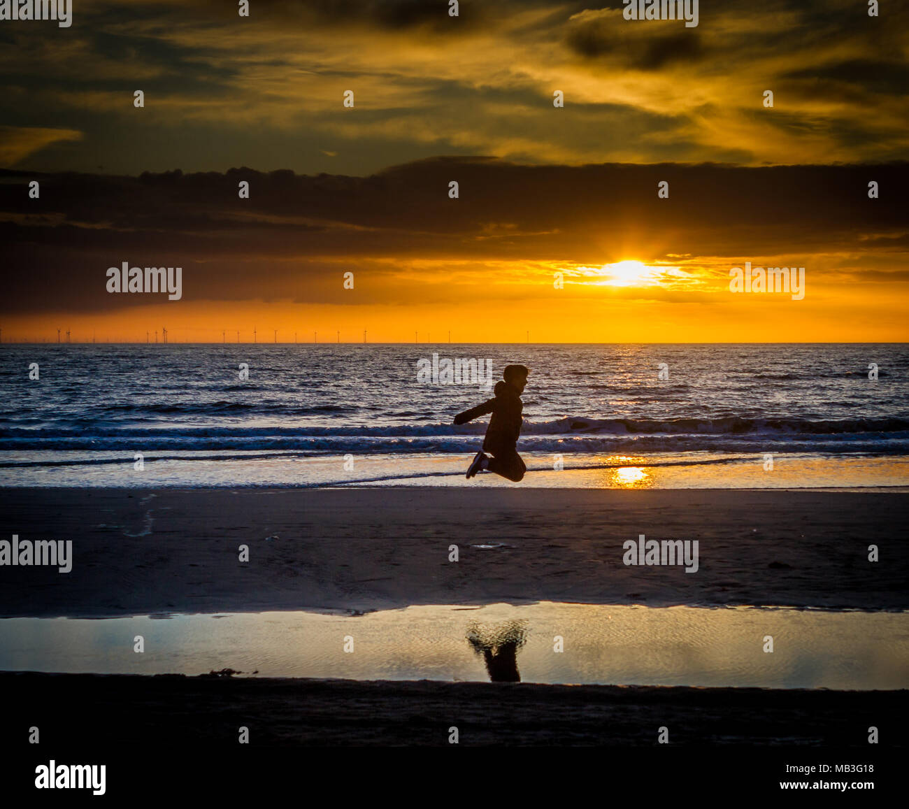 Kid in the sunset Stock Photo - Alamy