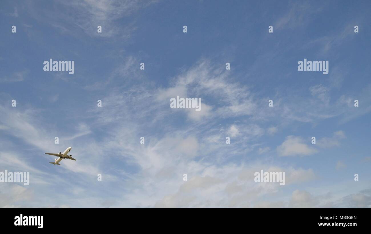 Airplane take off against the blue sky Stock Photo - Alamy