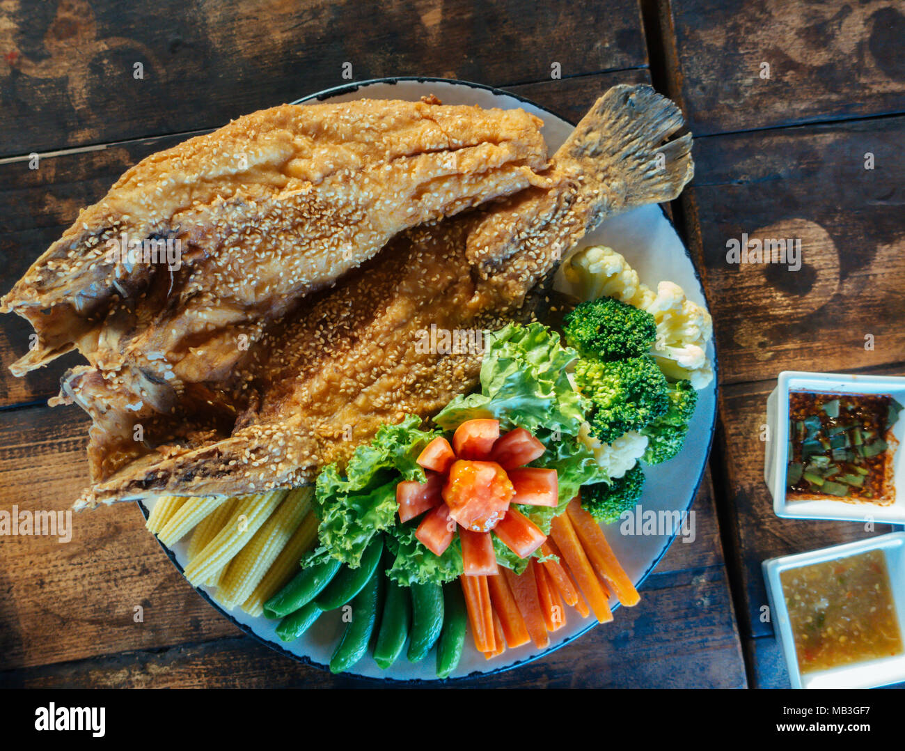 Thailand food fried snapper fish sprinkle sesame Stock Photo - Alamy