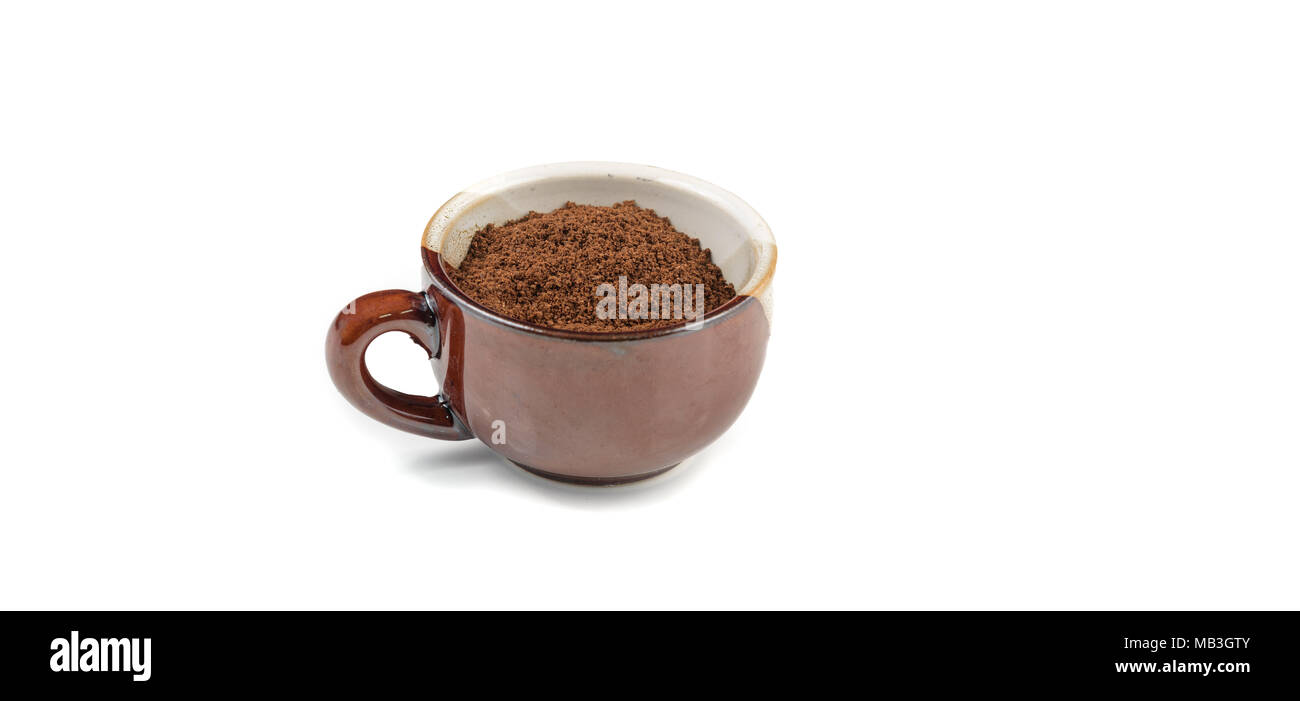a ceramic espresso mug full of freshly ground coffee Stock Photo - Alamy
