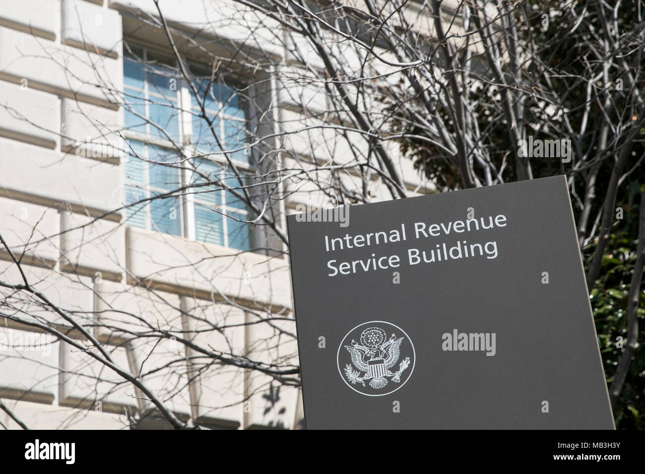 A logo sign outside of the headquarters of the Internal Revenue Service ...