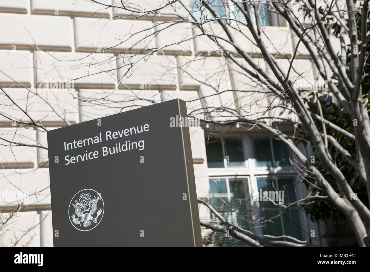 A logo sign outside of the headquarters of the Internal Revenue Service ...