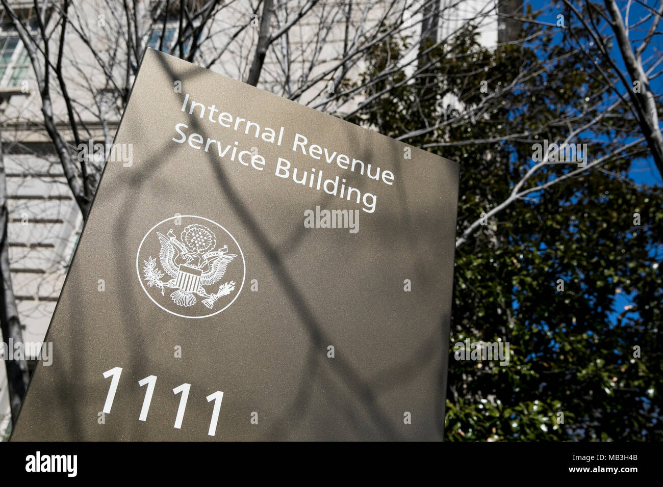 A logo sign outside of the headquarters of the Internal Revenue Service ...
