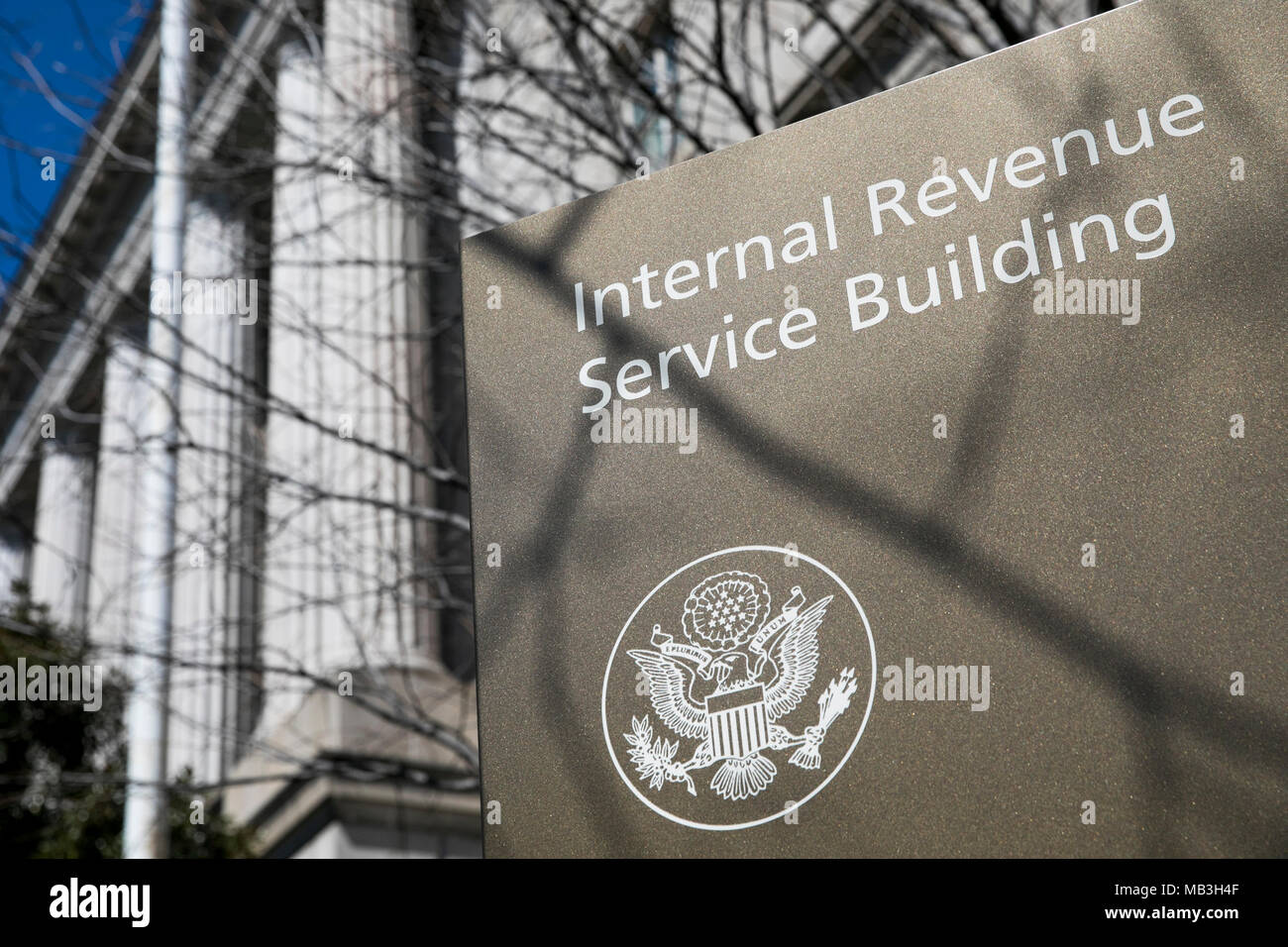 A logo sign outside of the headquarters of the Internal Revenue Service ...
