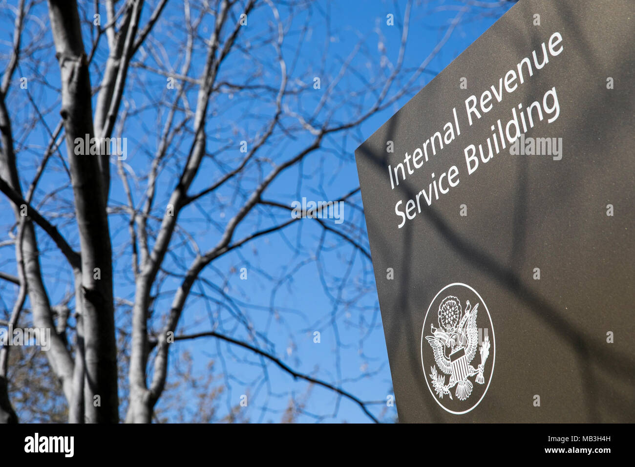A logo sign outside of the headquarters of the Internal Revenue Service ...