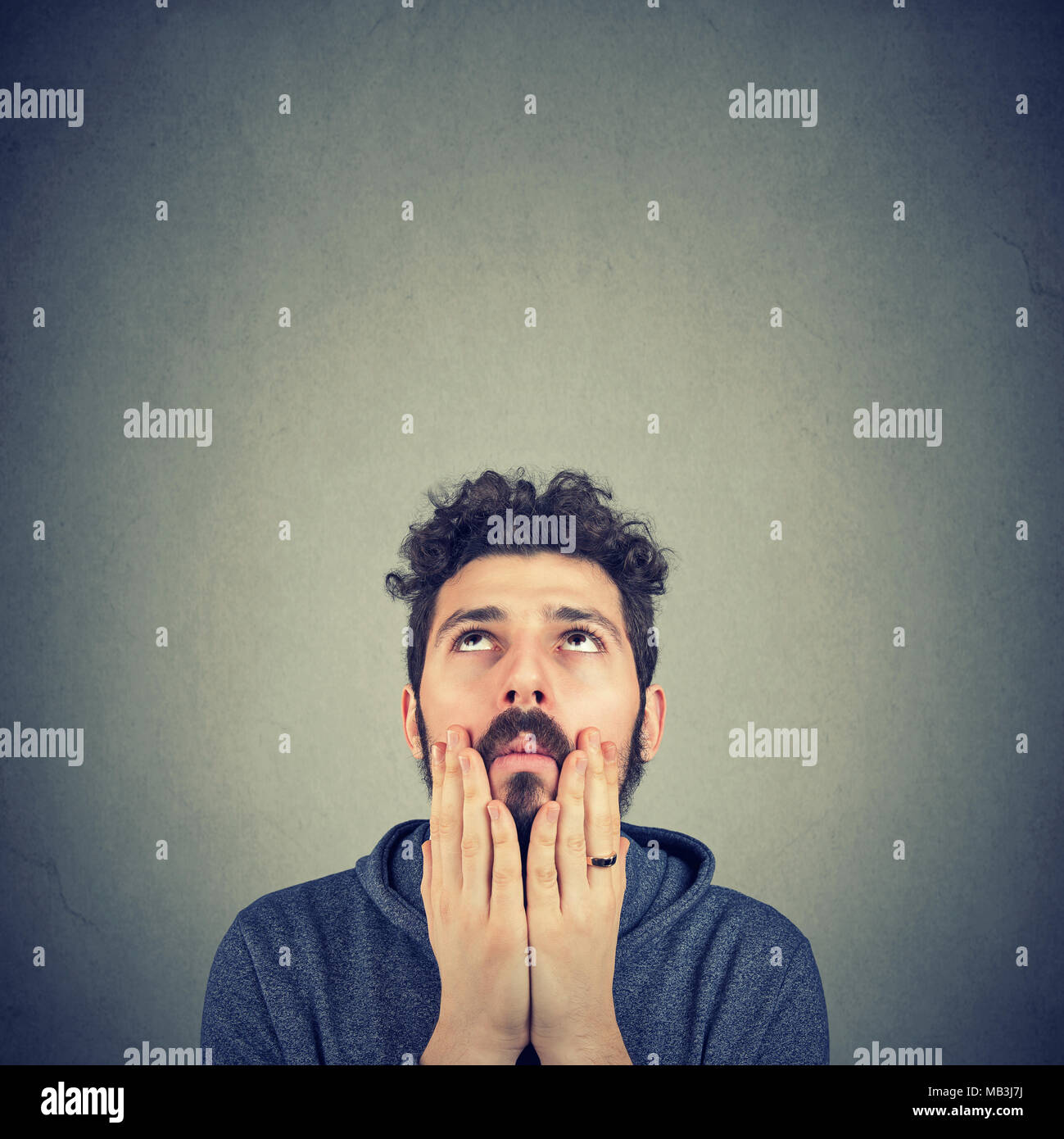 Desperate sad hipster man looking up with hope Stock Photo - Alamy