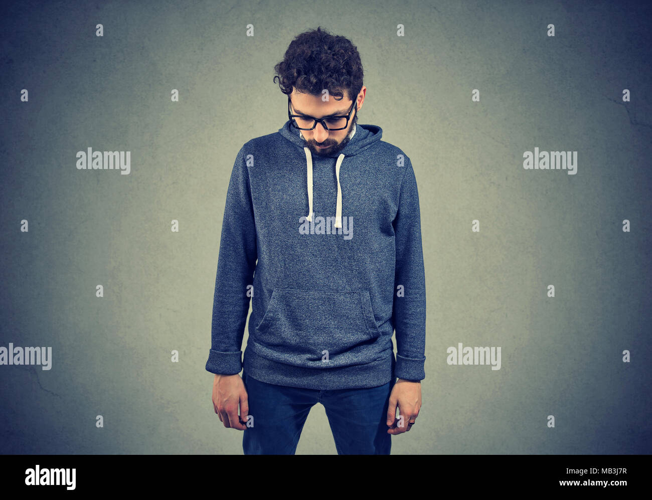 Dejected man looking down hi-res stock photography and images - Alamy