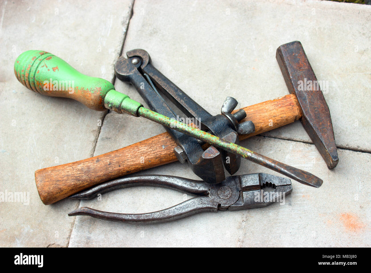 Old rusty tools must be replaced with new ones Stock Photo - Alamy