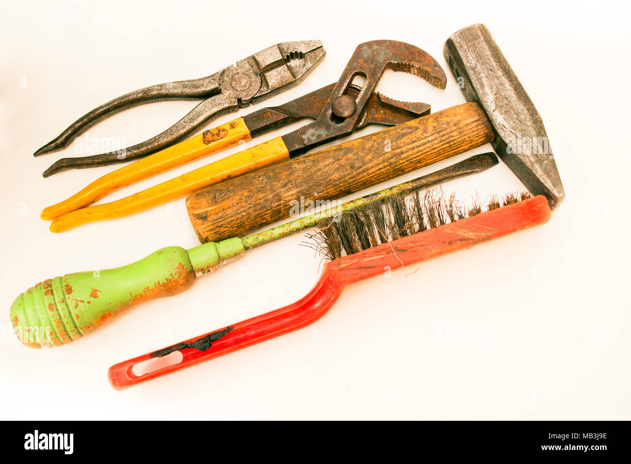 Old rusty tools must be replaced with new ones Stock Photo - Alamy