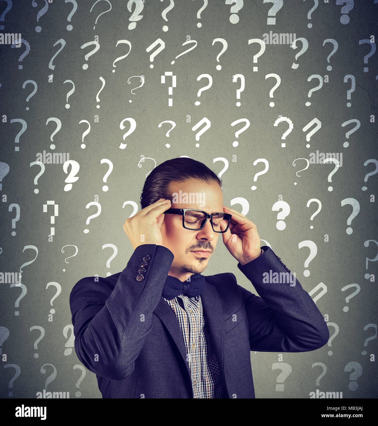 Stressed overburdened young man has too many questions and no answer ...