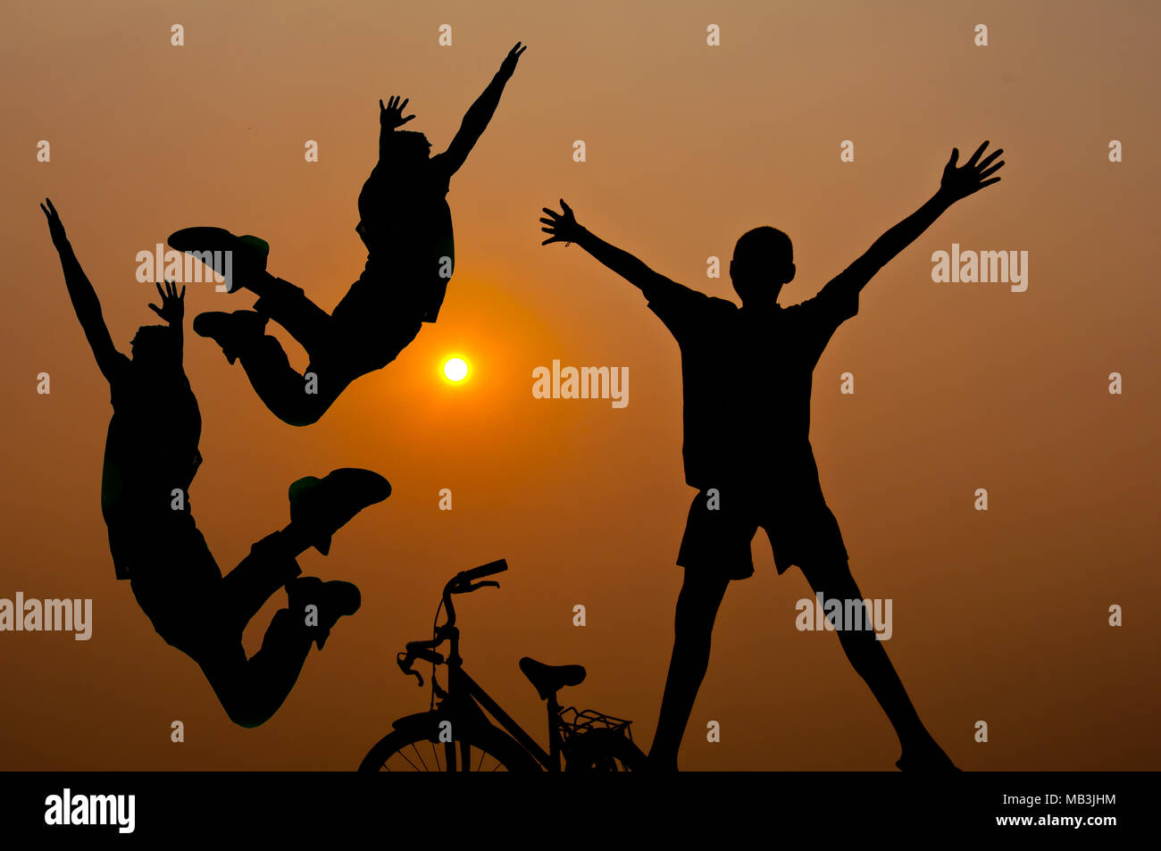 silhouette of man jumping for victory Stock Photo - Alamy