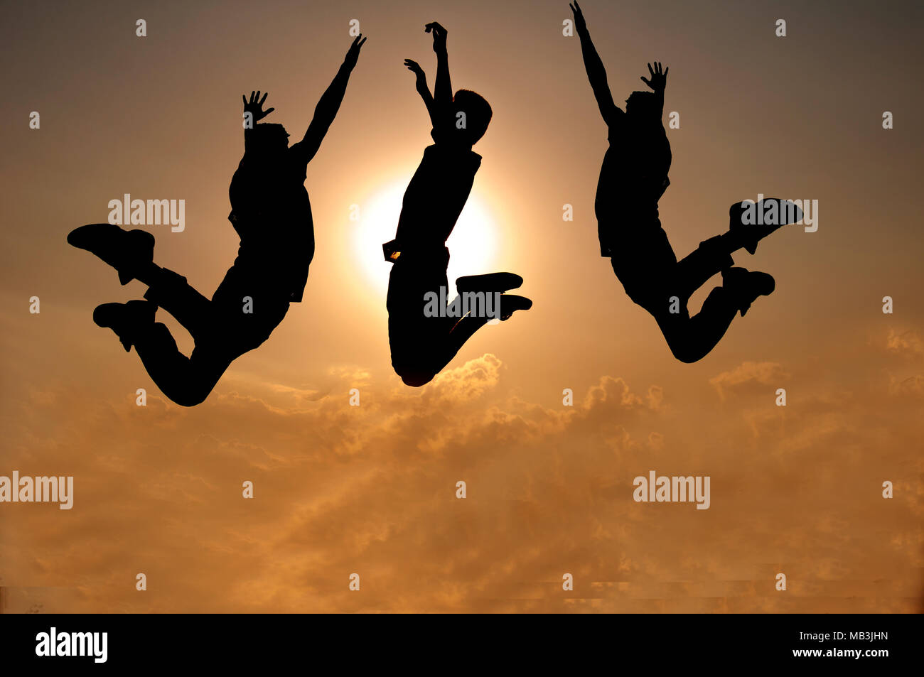 silhouette of man jumping for victory Stock Photo - Alamy