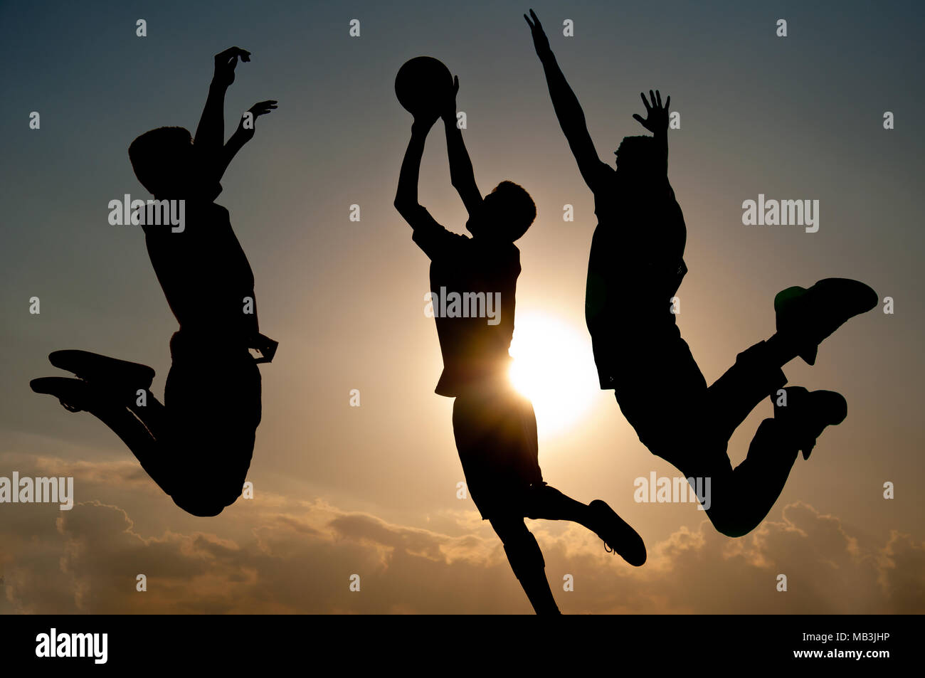 silhouette of man jumping for victory Stock Photo - Alamy