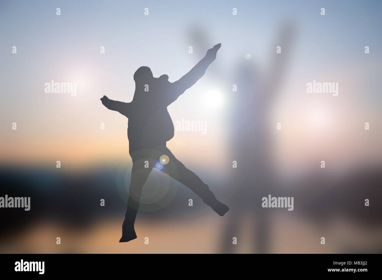 silhouette of man jumping for victory Stock Photo - Alamy