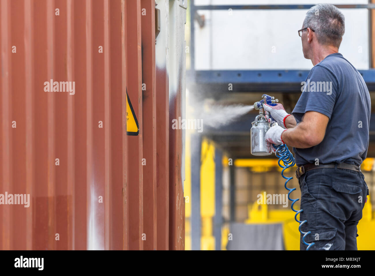 Coloring the container Stock Photo - Alamy