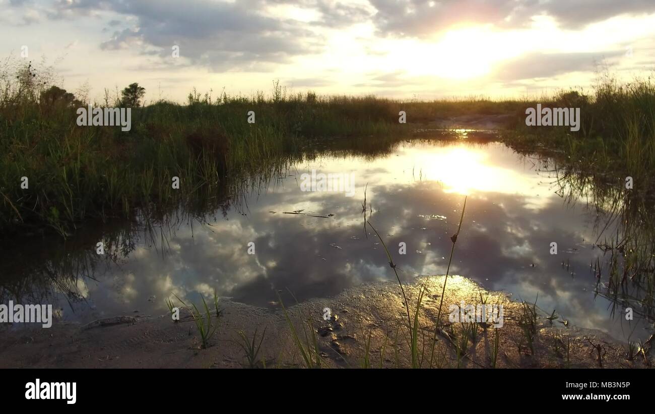 Nature landscape lake reflection of clouds in the water sunset sunlight ...