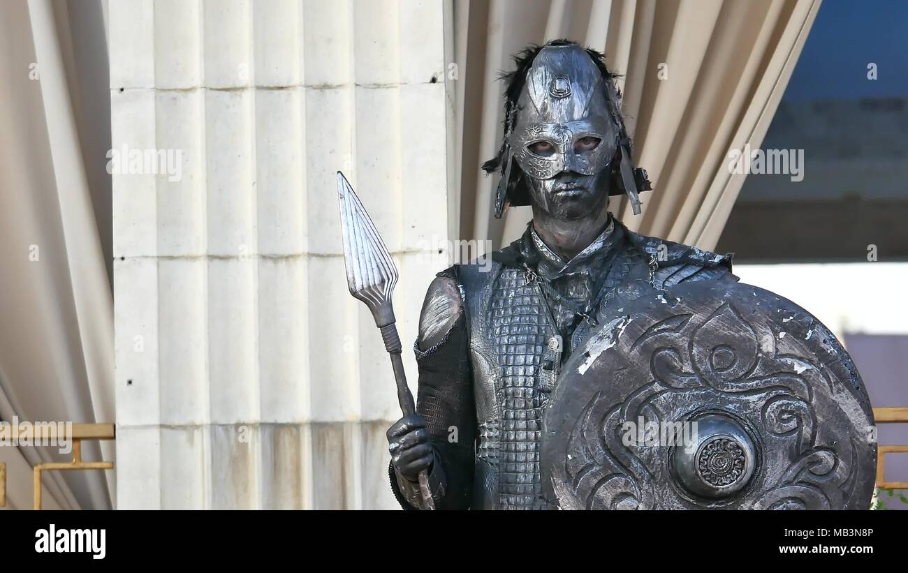 Ancient warrior or Gladiator posing over a dark background Stock Photo ...