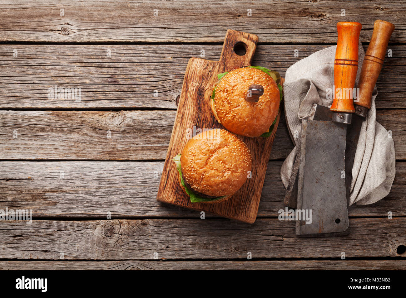 Tasty grilled home made burgers with beef, tomato, cheese, cucumber and ...