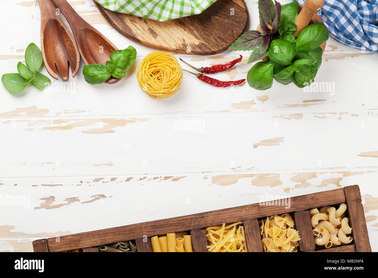 Cooking table with utensils and ingredients on white wood. Top view ...