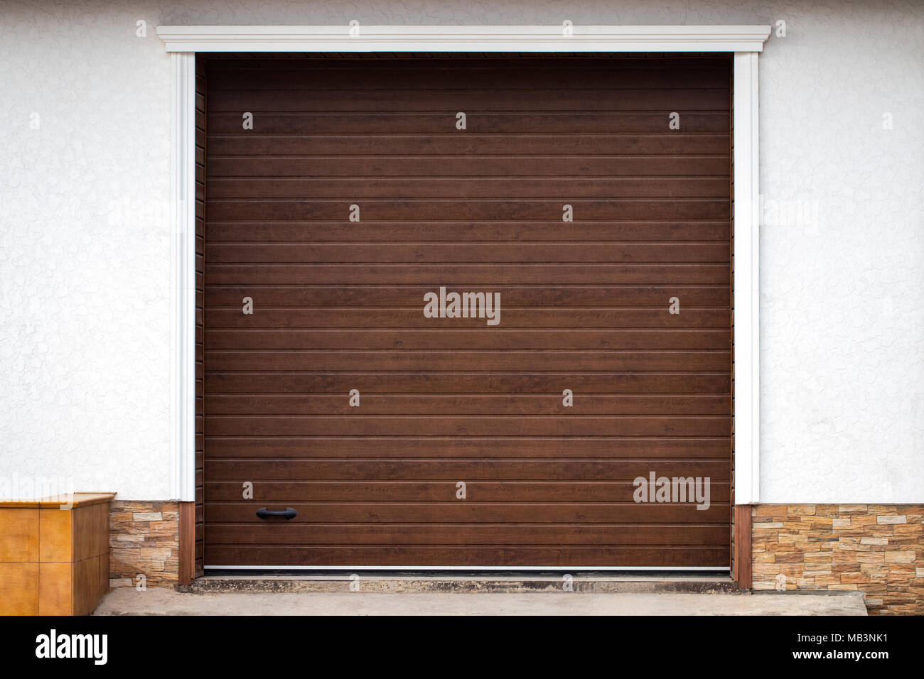 Wooden wall of modern rural garage with the automatic lifted gate Stock ...